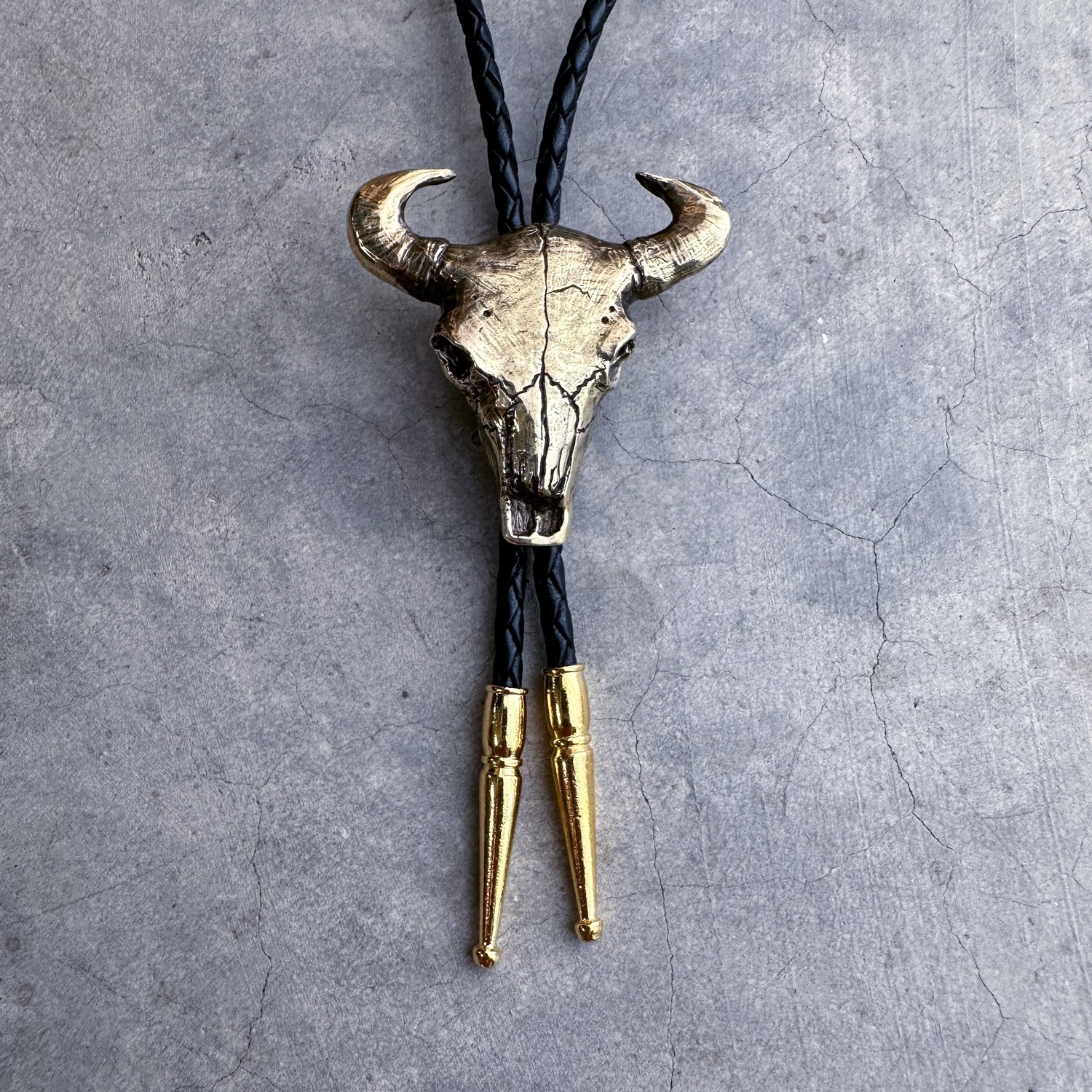 Handcrafted Brass Skull Bolo Tie – C.M. Russell Museum
